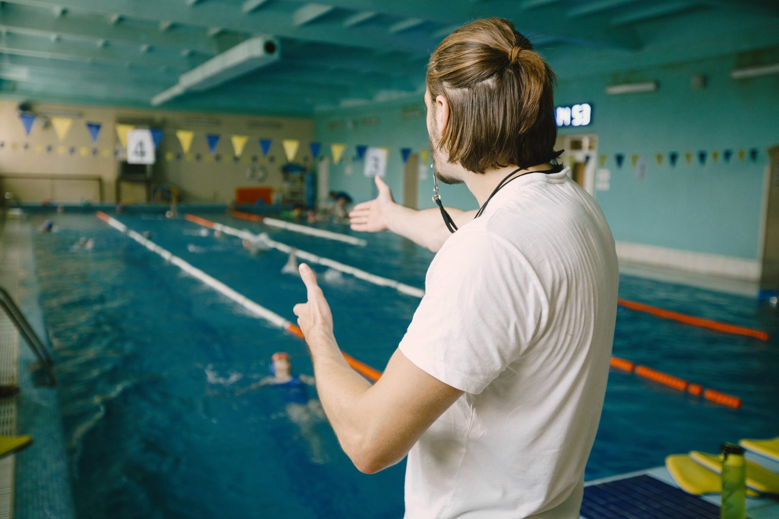 Coach practise with swimmer in the indoor swimming pool - St. Bernard's ...